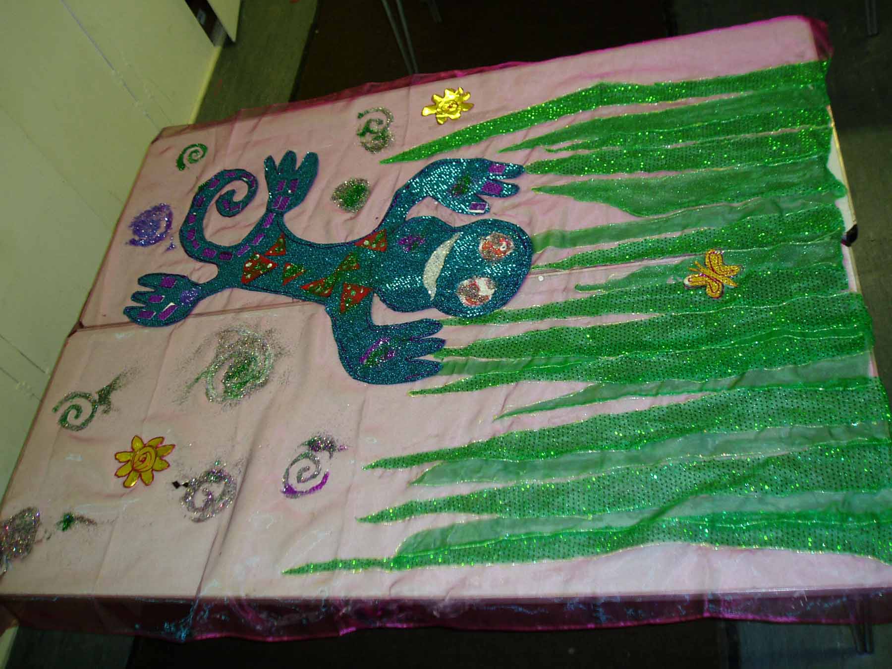 A blue Groovy Gecko banner - Living Archive