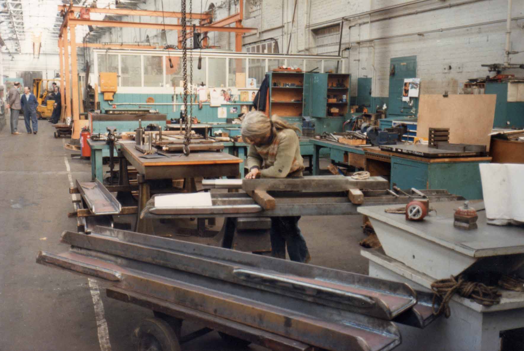 Fitter Martin Higgs marking out crane arms - Living Archive