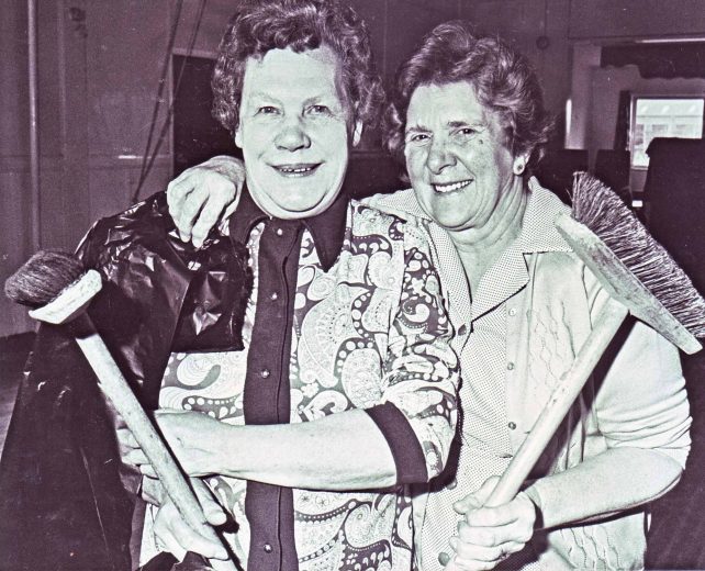 Two women with brooms - Living Archive
