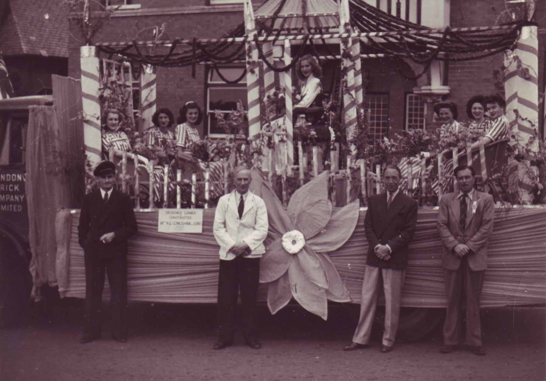 Carnival lorry with Alfred Cowlishaw in white jacket - Living Archive